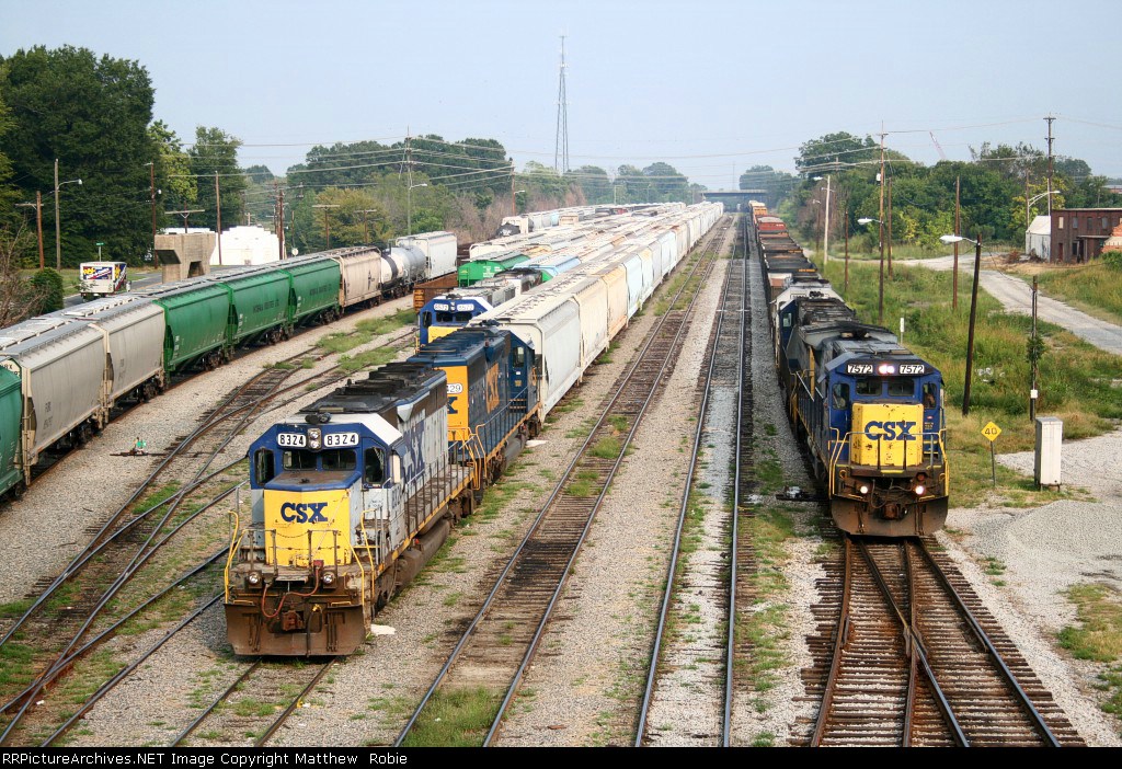 CSX Q667 passes CSX locals